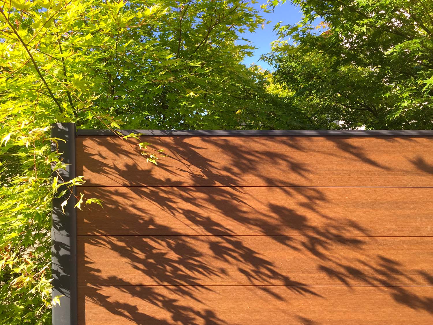 Réalisations Clôture composite teinte teck